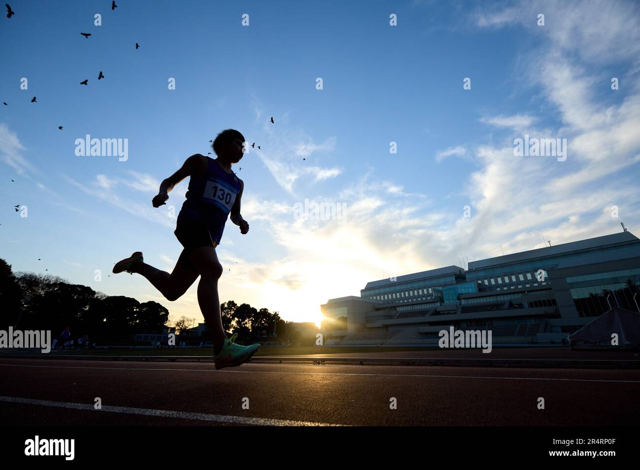 Japanese athletes running on track Stock Photo - Alamy