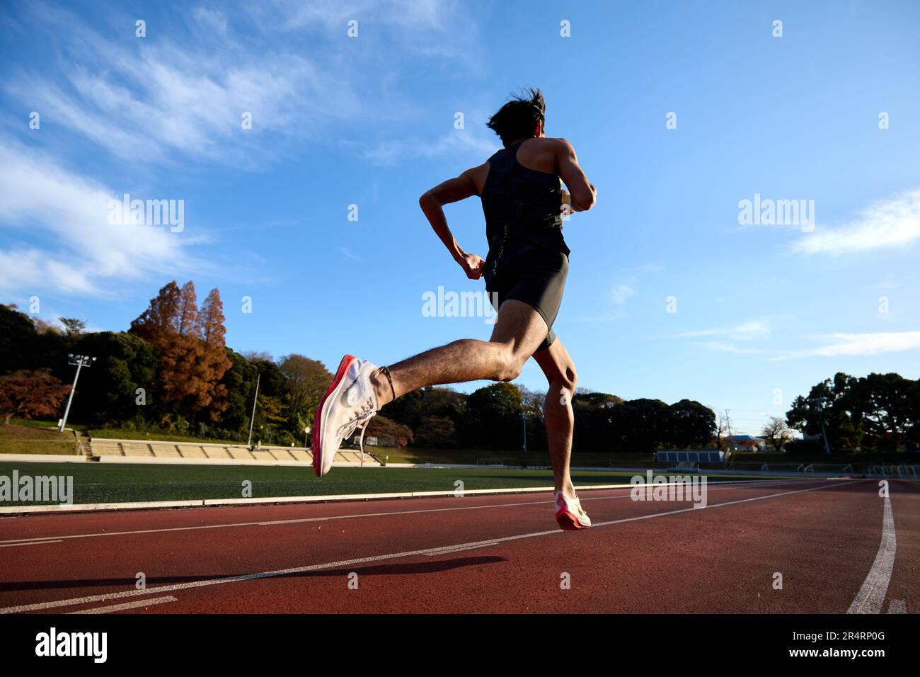 Japanese athletes running on track Stock Photo - Alamy