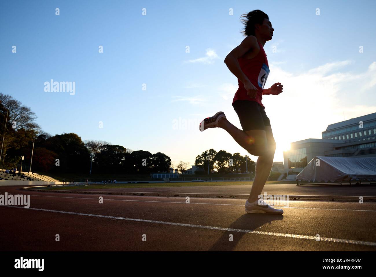 Japanese athletes running on track Stock Photo - Alamy