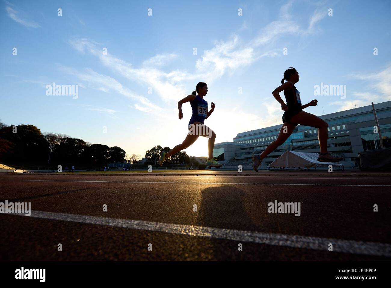 Japanese athletes running on track Stock Photo - Alamy