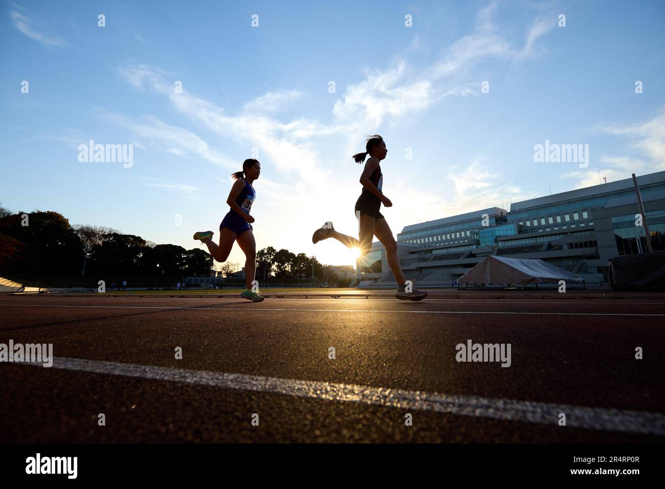 Japanese athletes running on track Stock Photo - Alamy