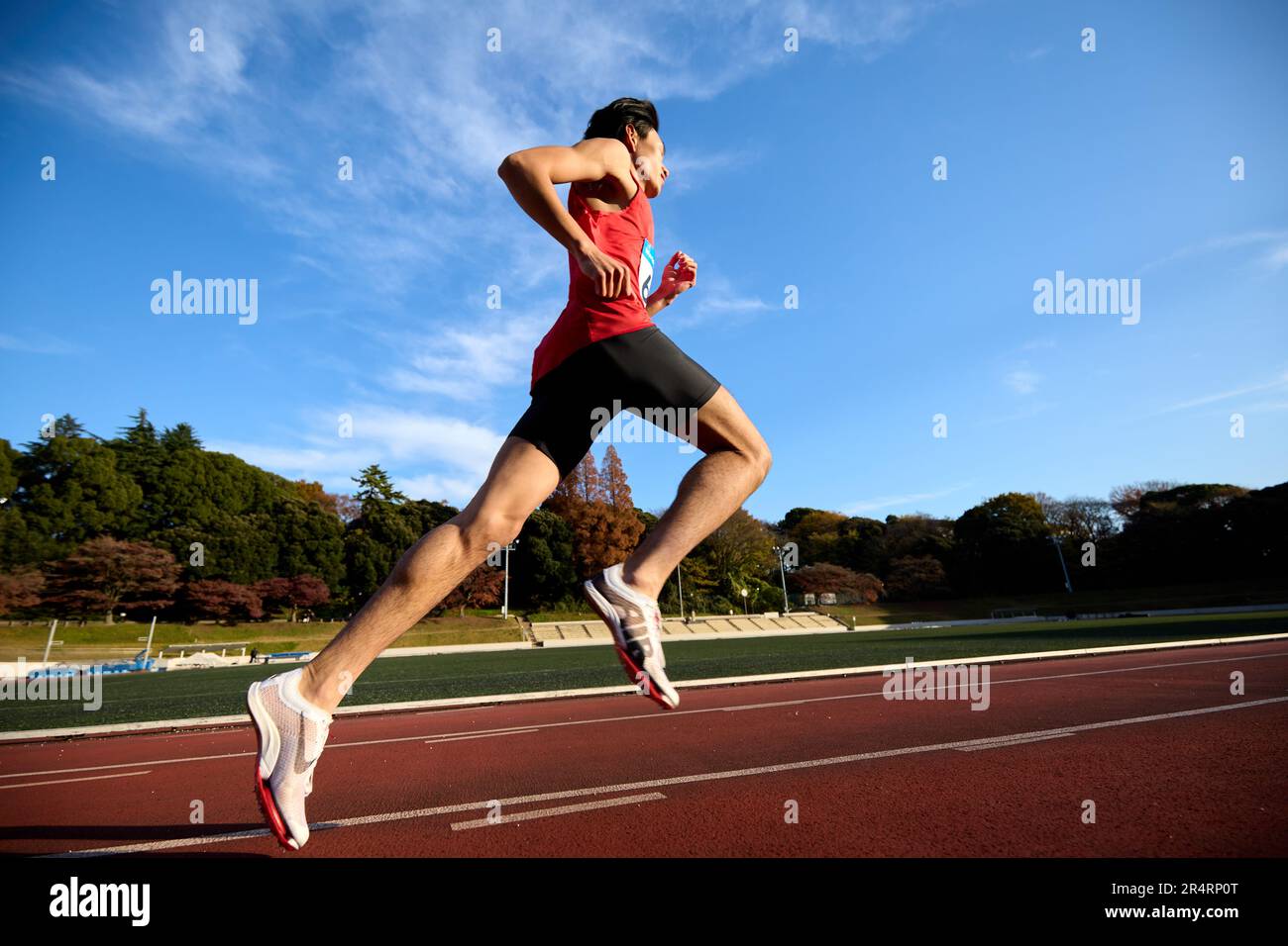 Japanese athletes running on track Stock Photo - Alamy