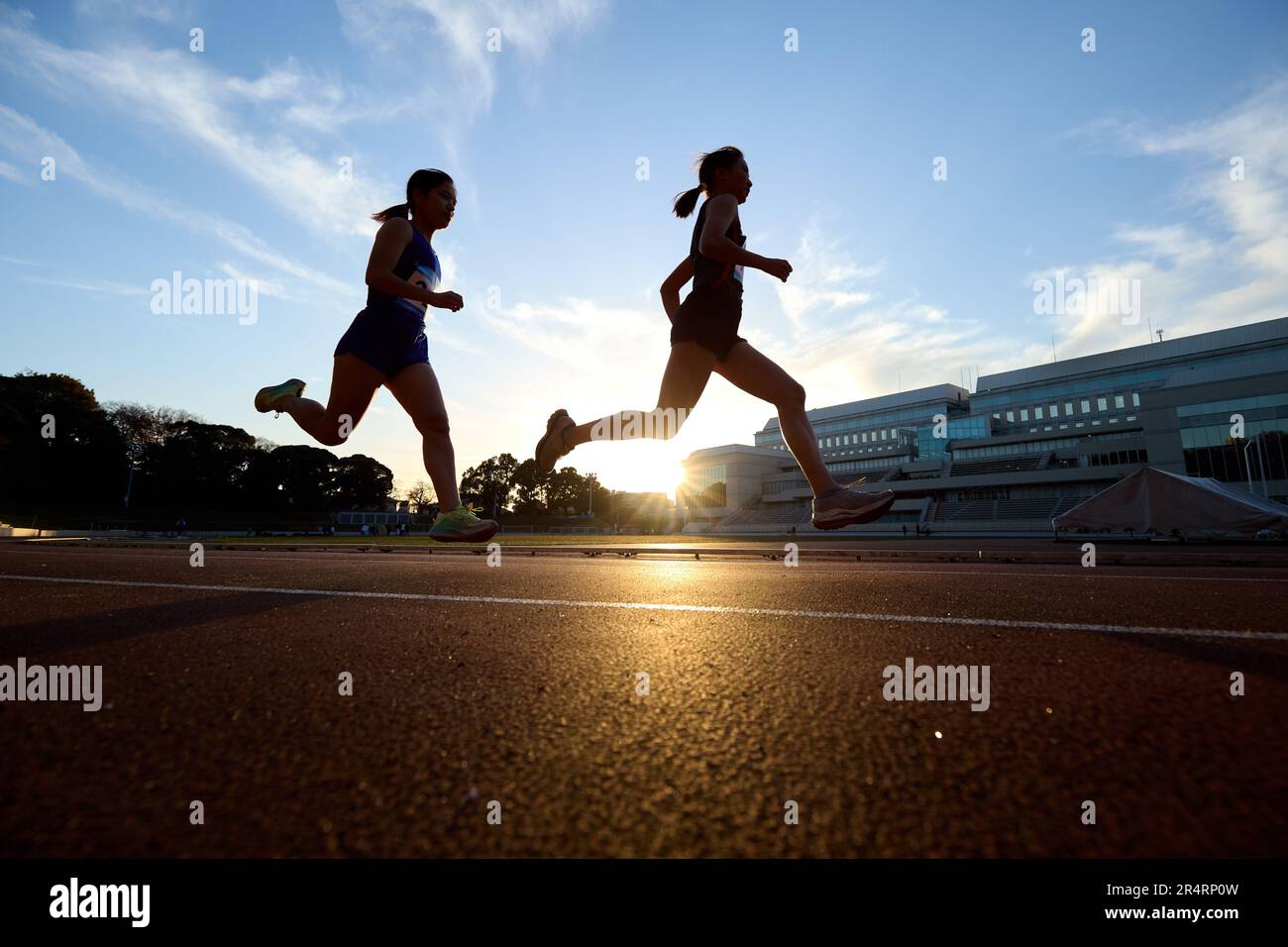 Japanese athletes running on track Stock Photo - Alamy