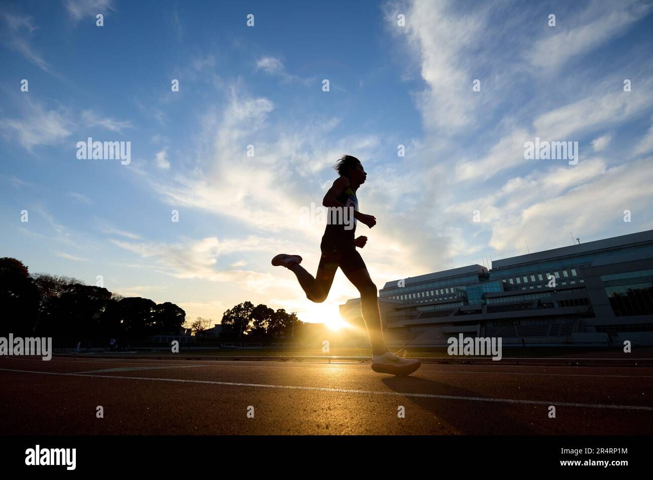 Japanese athletes running on track Stock Photo - Alamy