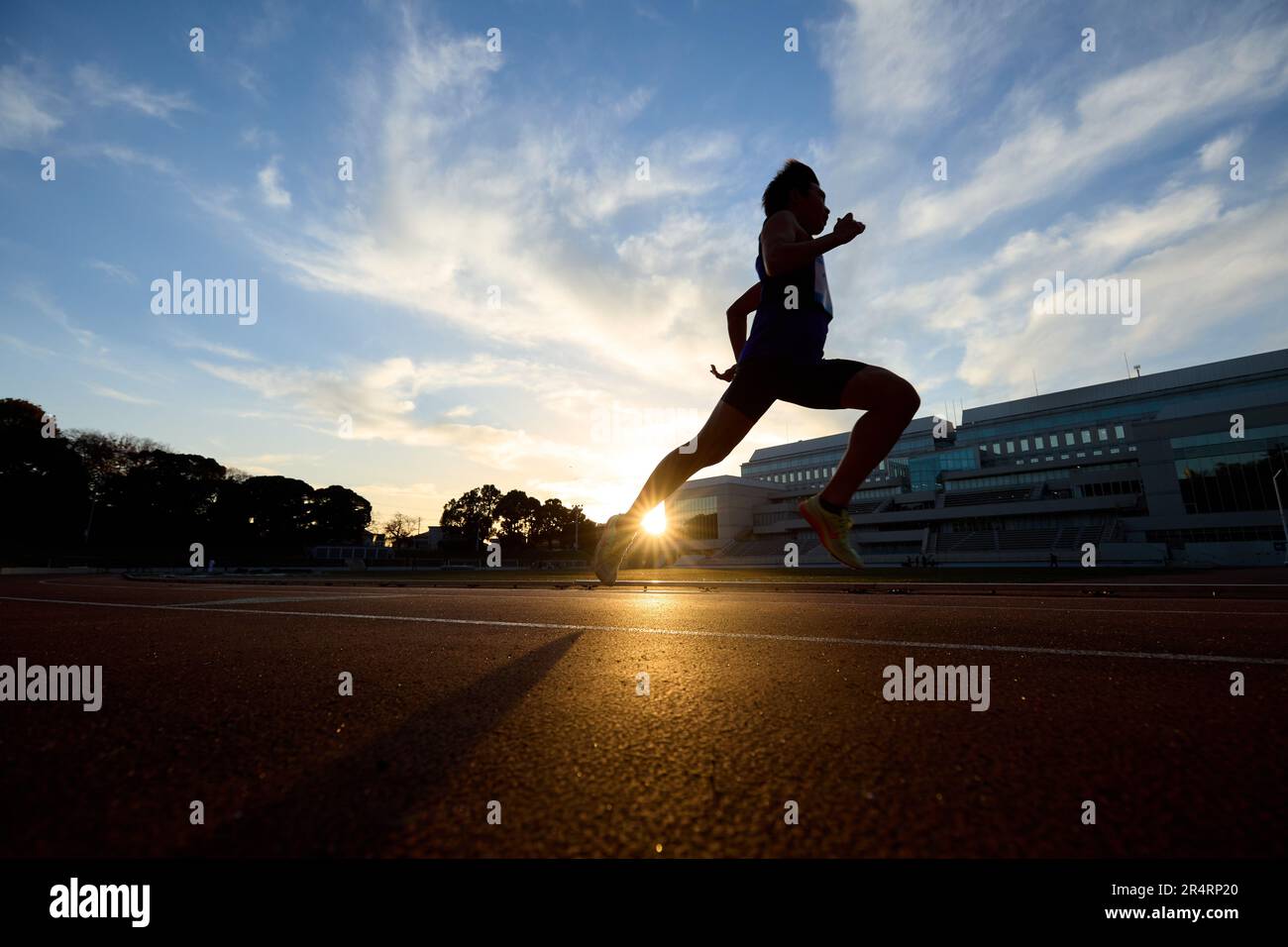 Japanese athletes running on track Stock Photo - Alamy
