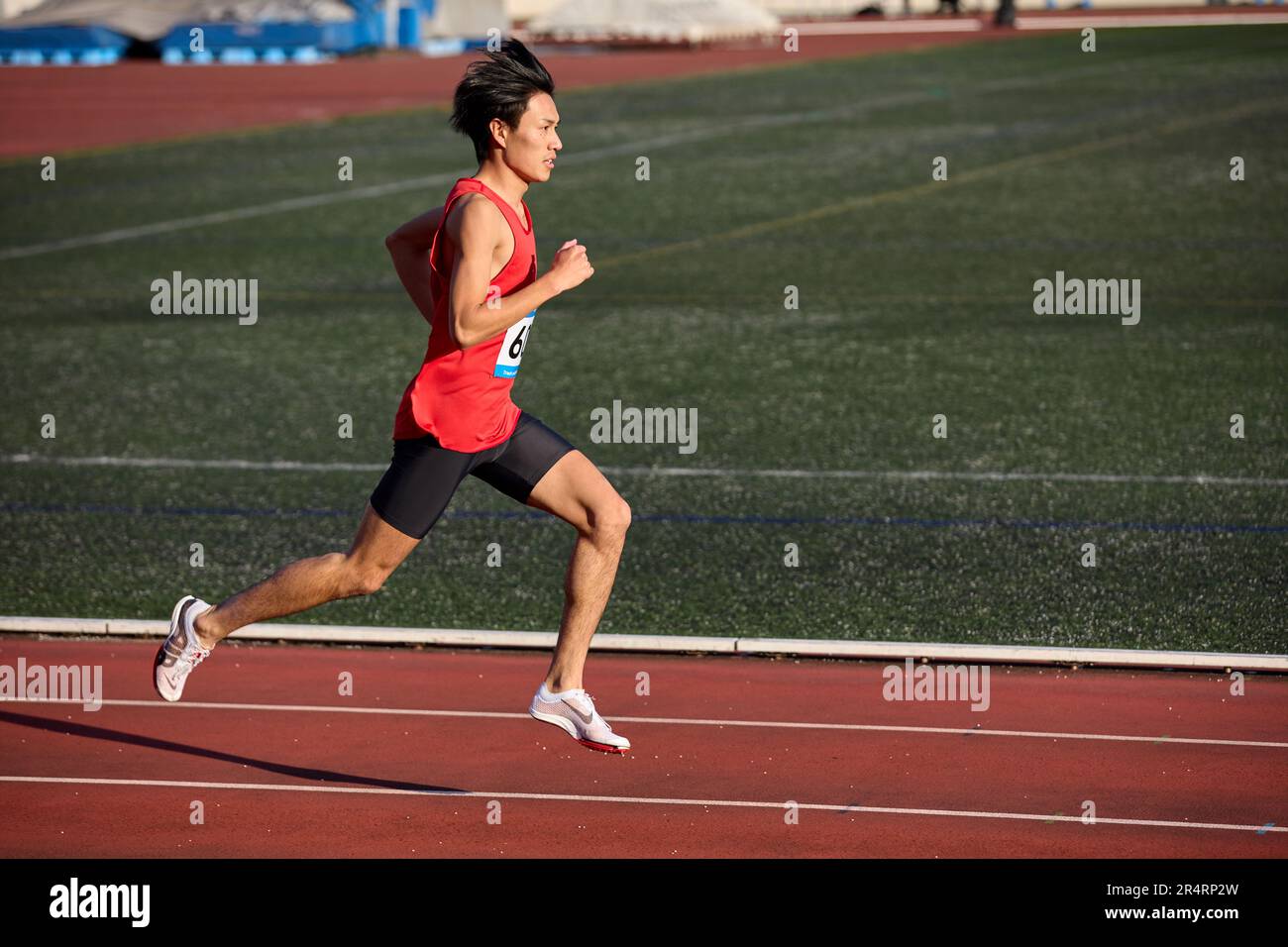 Japanese athletes running on track Stock Photo - Alamy