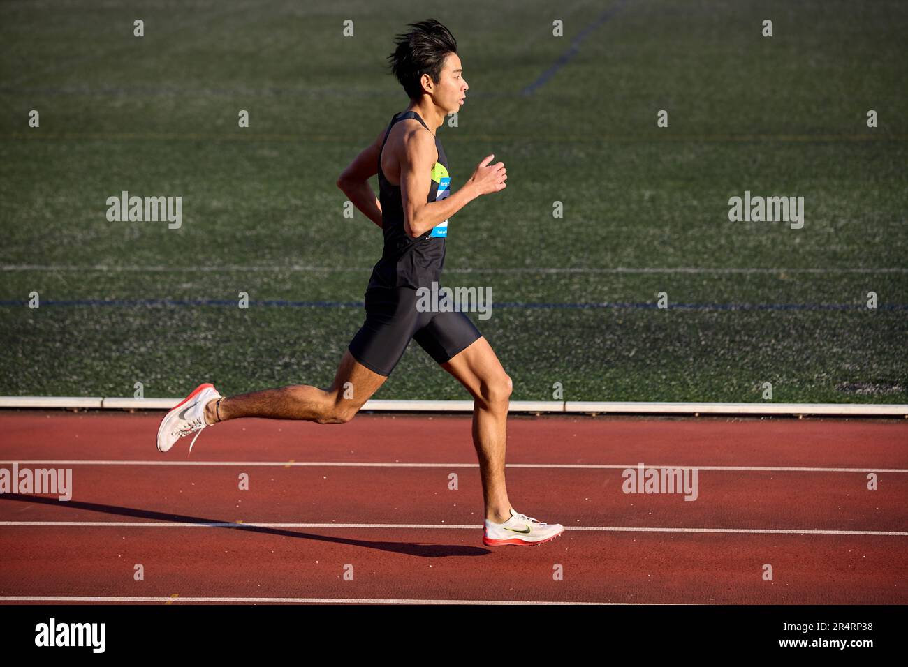 Japanese athletes running on track Stock Photo - Alamy