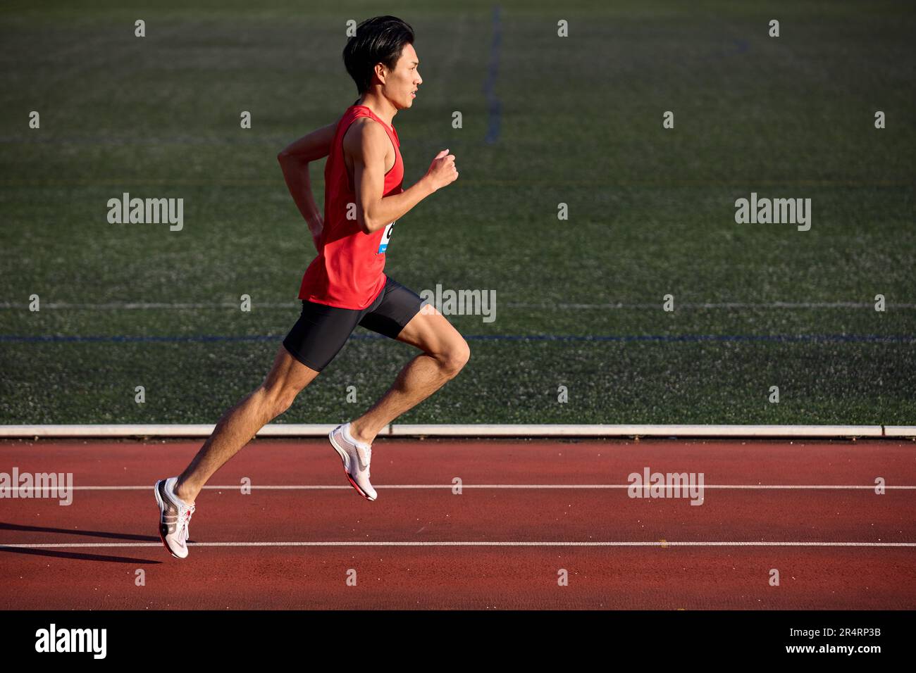 Japanese athletes running on track Stock Photo - Alamy