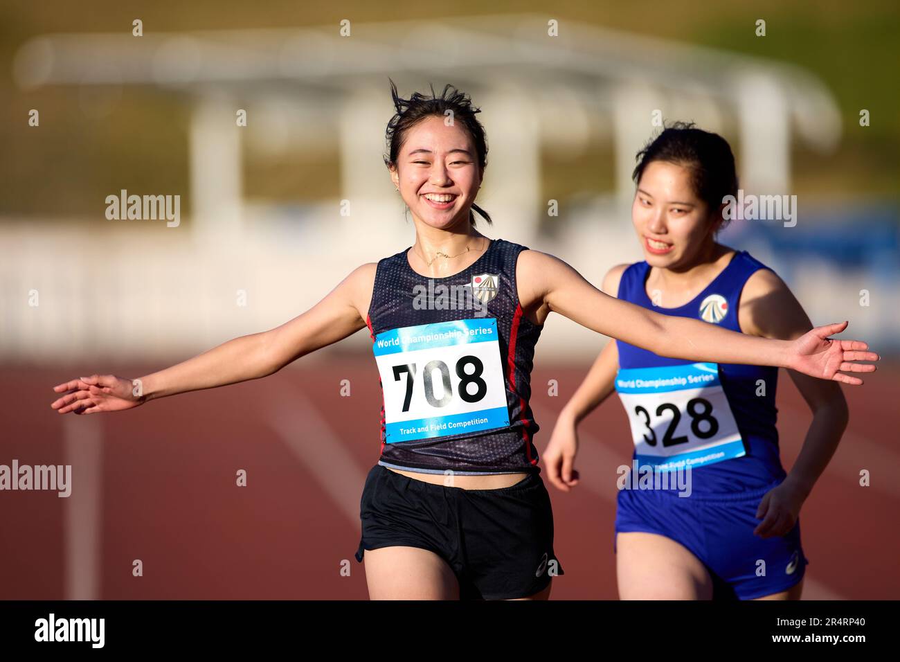 Japanese athletes running on track Stock Photo - Alamy