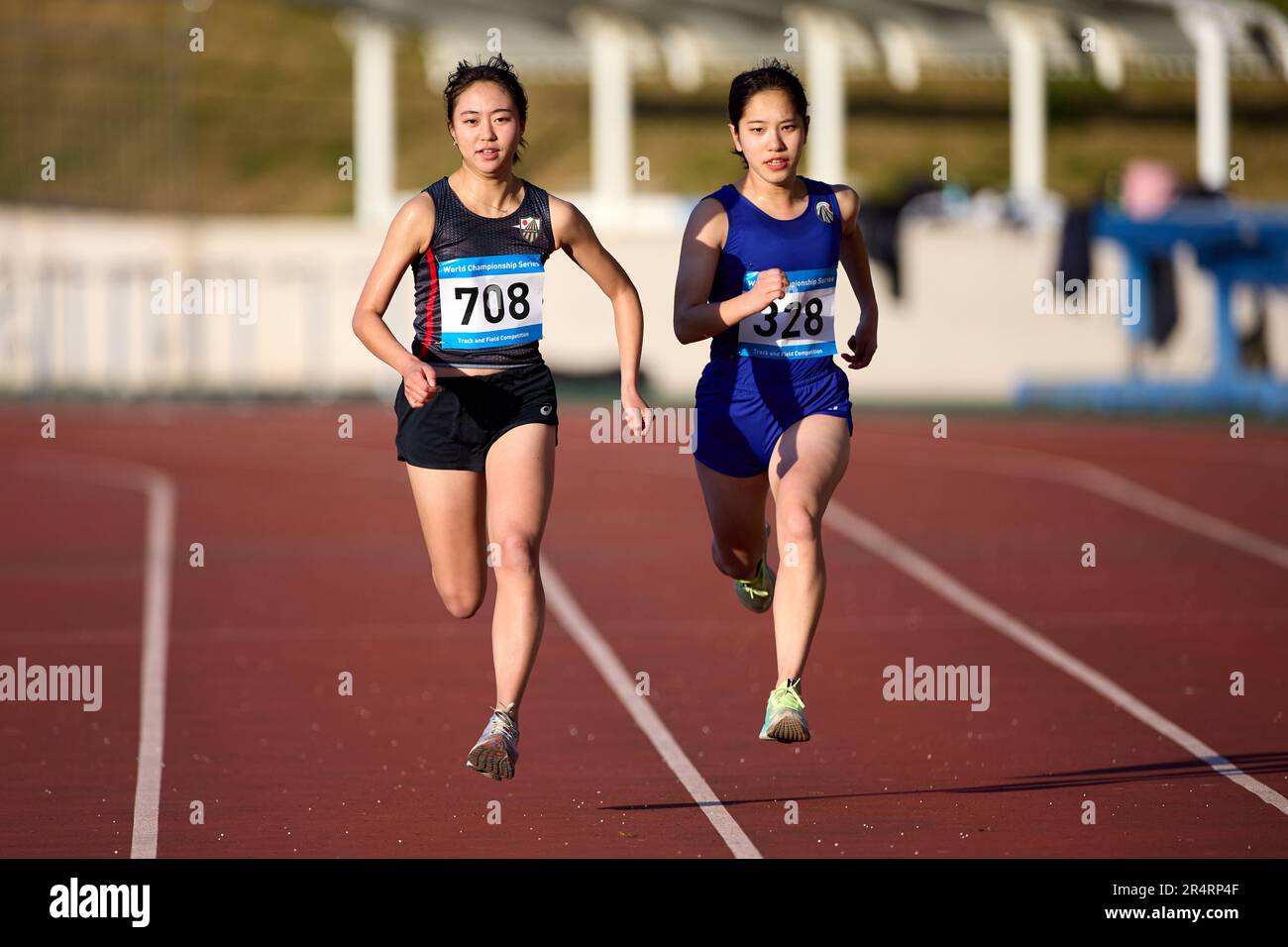 Japanese athletes running on track Stock Photo - Alamy