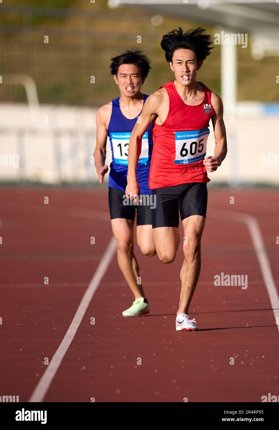 Japanese athletes running on track Stock Photo - Alamy