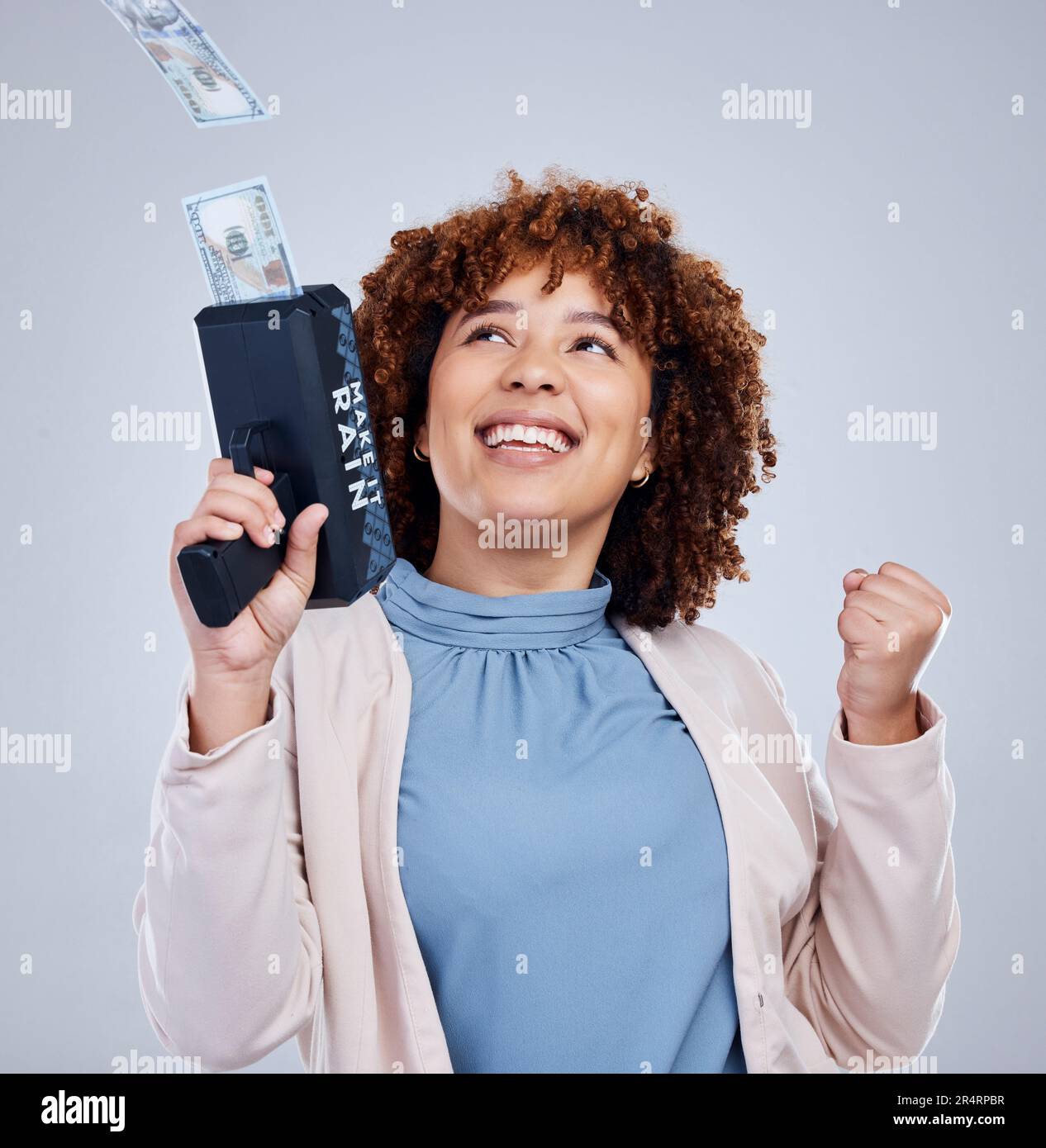 Money, shooting and winning woman isolated on studio background in ...
