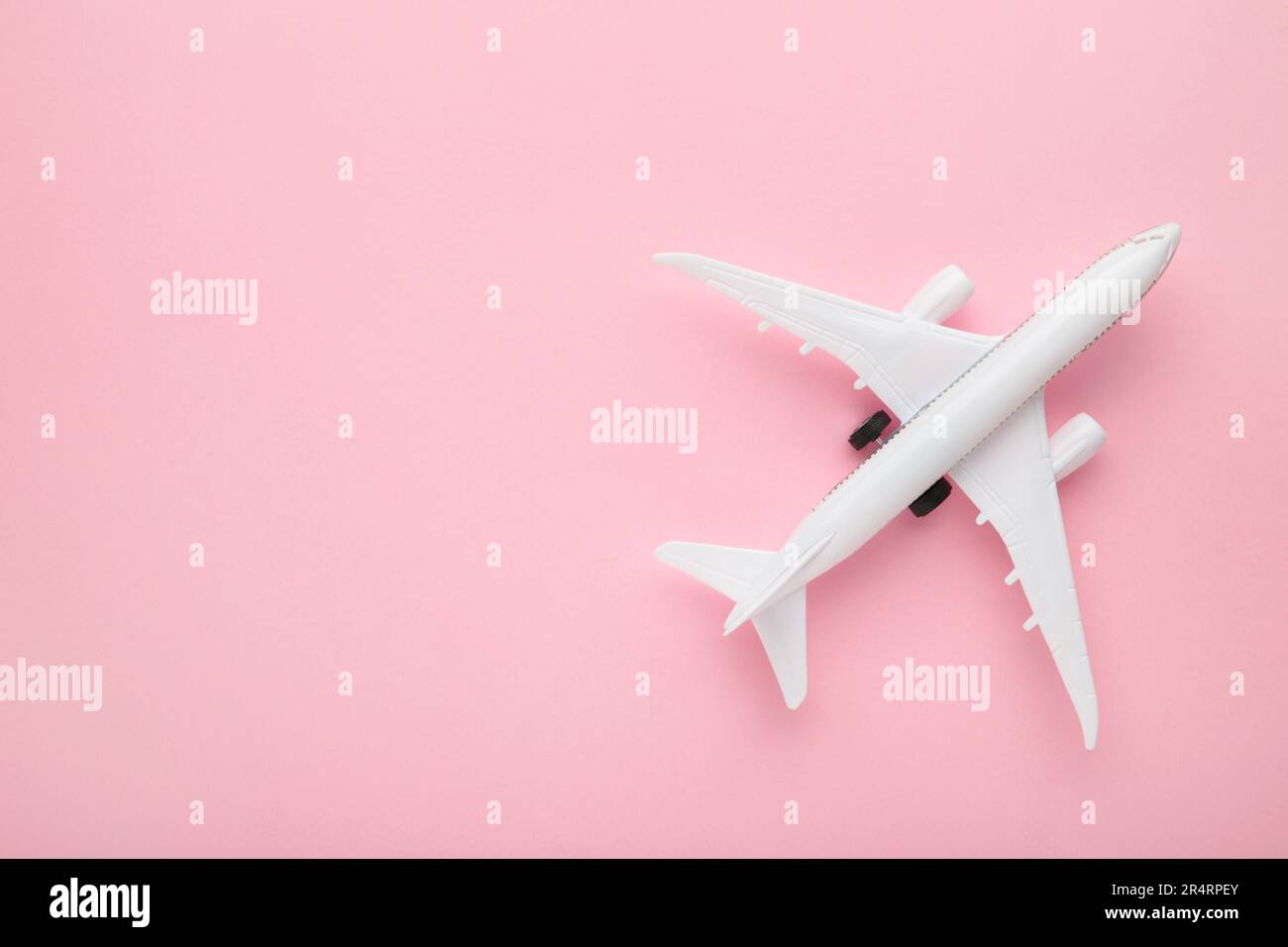 Model airplane on pink pastel color background. Travel concept Stock ...