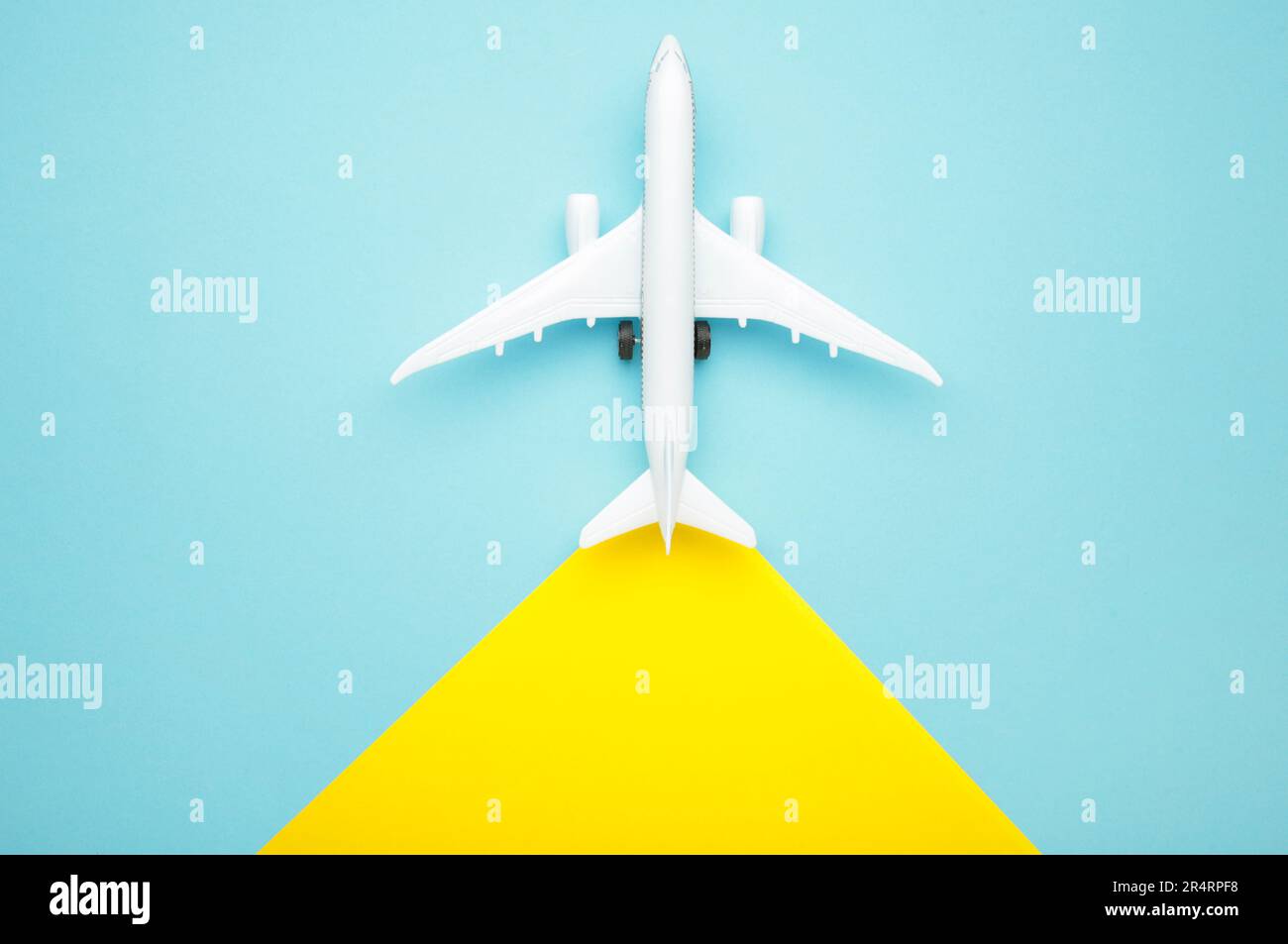 Model airplane on yellow and blue background. Travel concept Stock ...