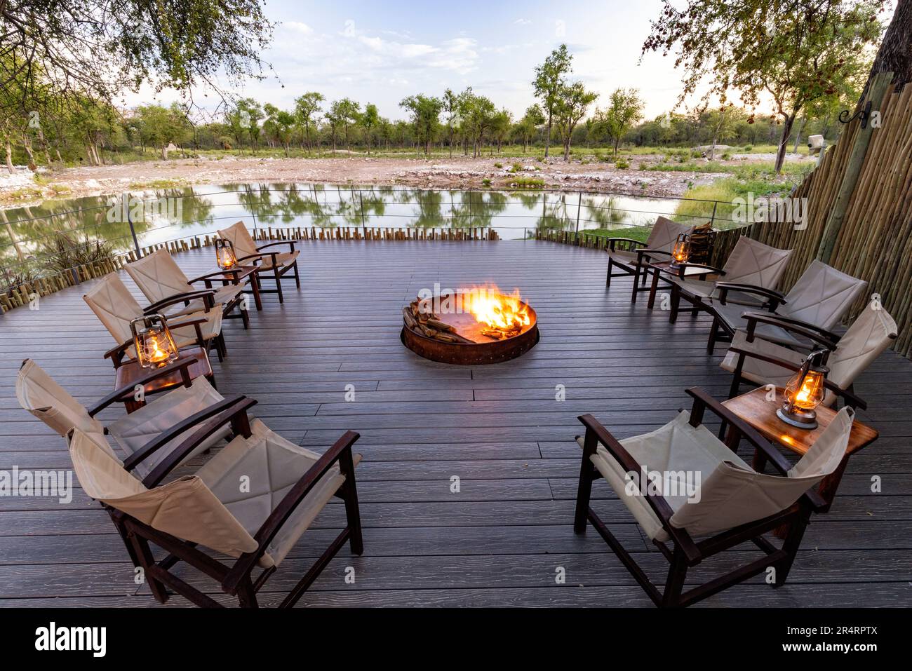 Campfire by the waterhole at Onguma Forest Camp, Onguma Game Reserve ...