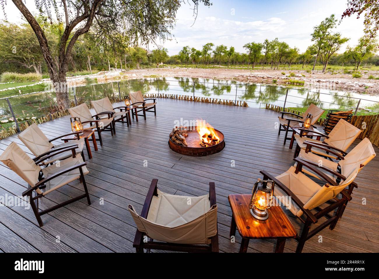 Campfire by the waterhole at Onguma Forest Camp, Onguma Game Reserve ...