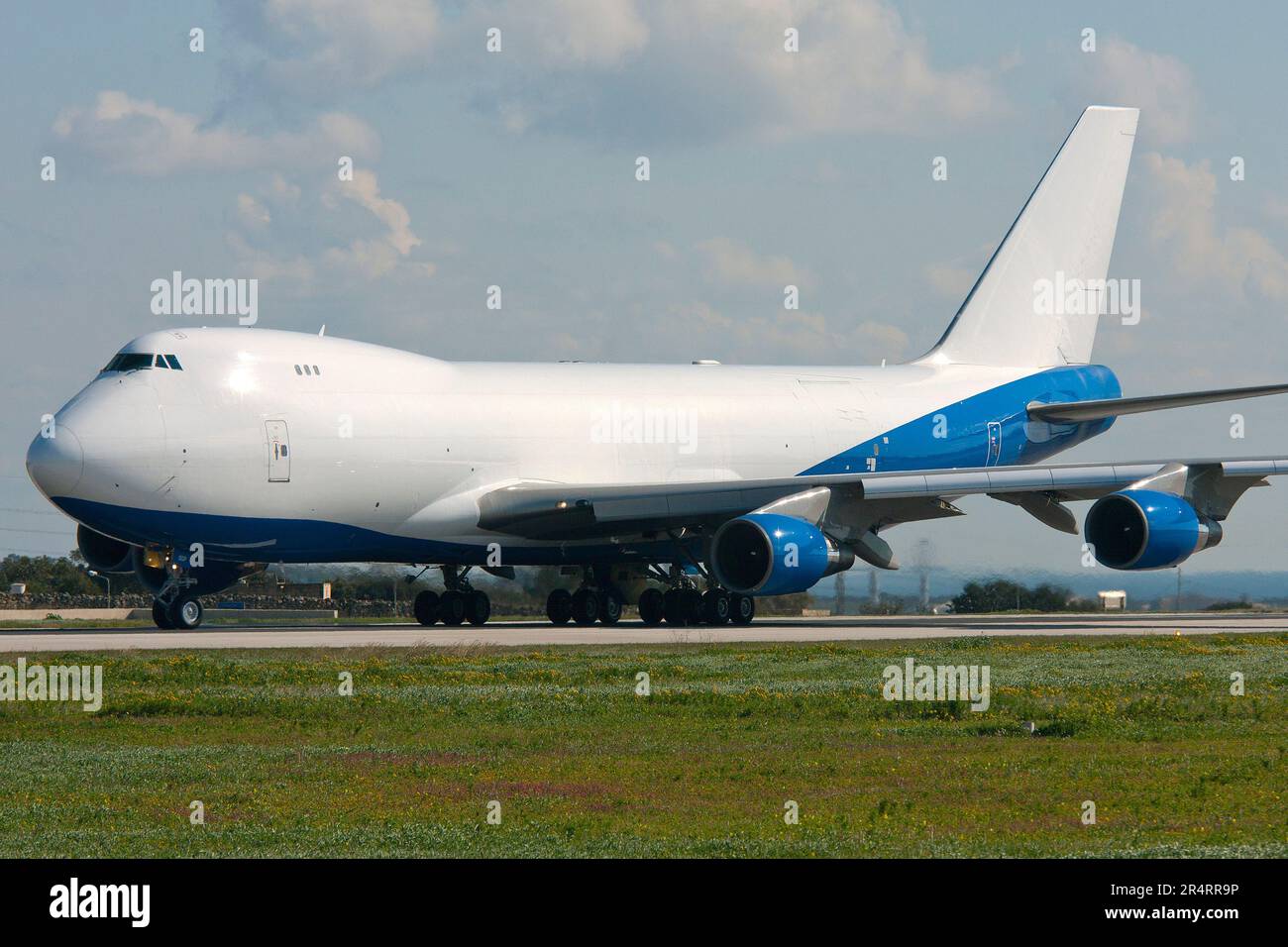 Boeing 747-2B4BM(SF) (Reg: A6-GGP) lining up for takeoff Stock Photo ...