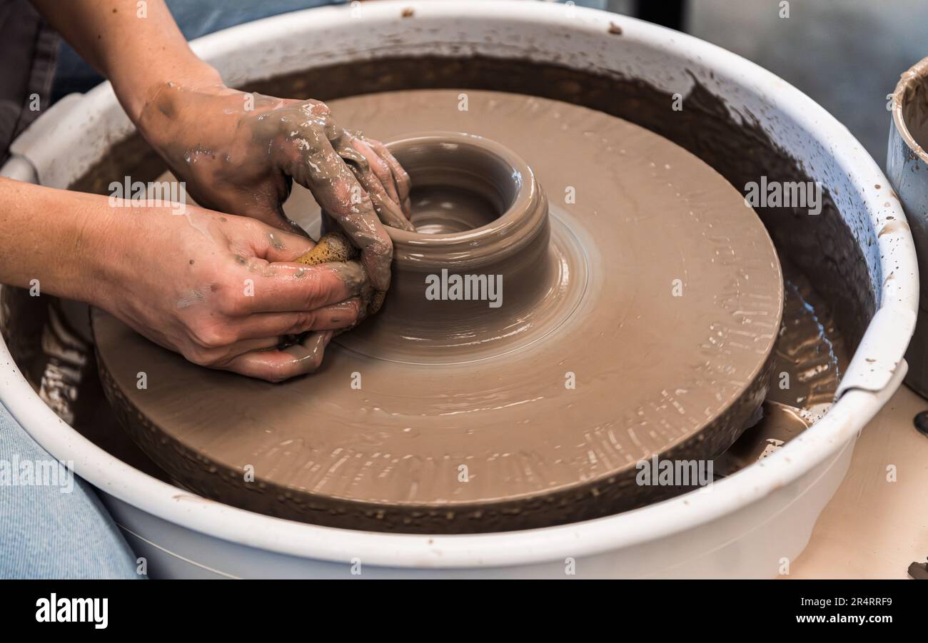 Female pottery artist hands hi-res stock photography and images - Alamy