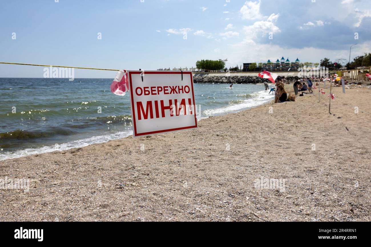 ODESSA, UKRAINE - MAY 15, 2023: mine hazard sign on city sea sandy ...