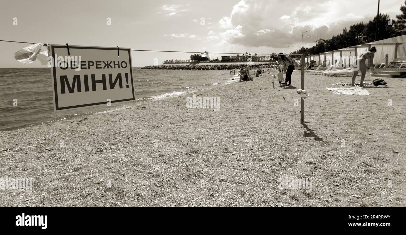 ODESSA, UKRAINE - MAY 15, 2023: mine hazard sign on city sea sandy ...