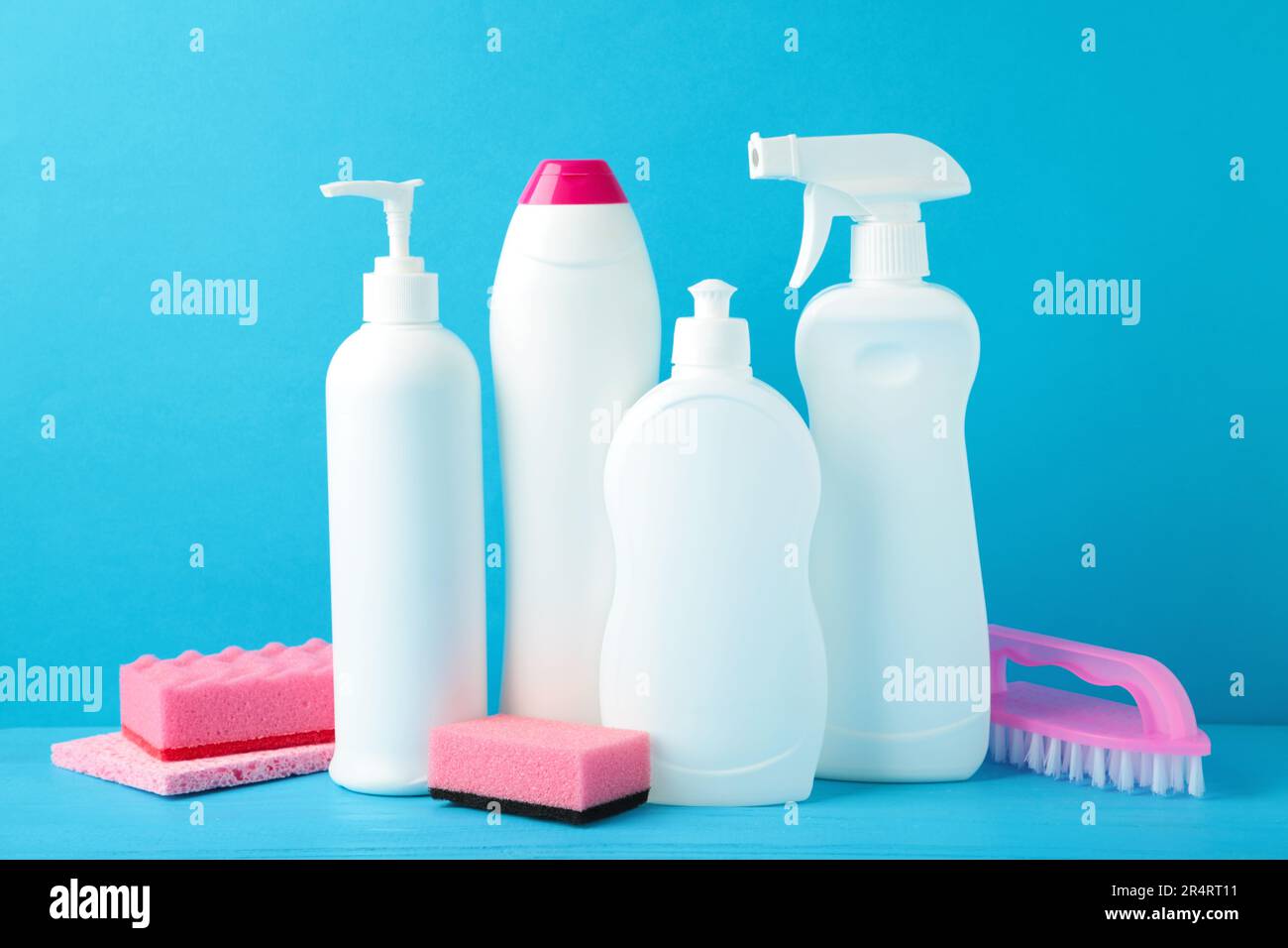 Set of cleaning tools on a blue background. Top view Stock Photo - Alamy