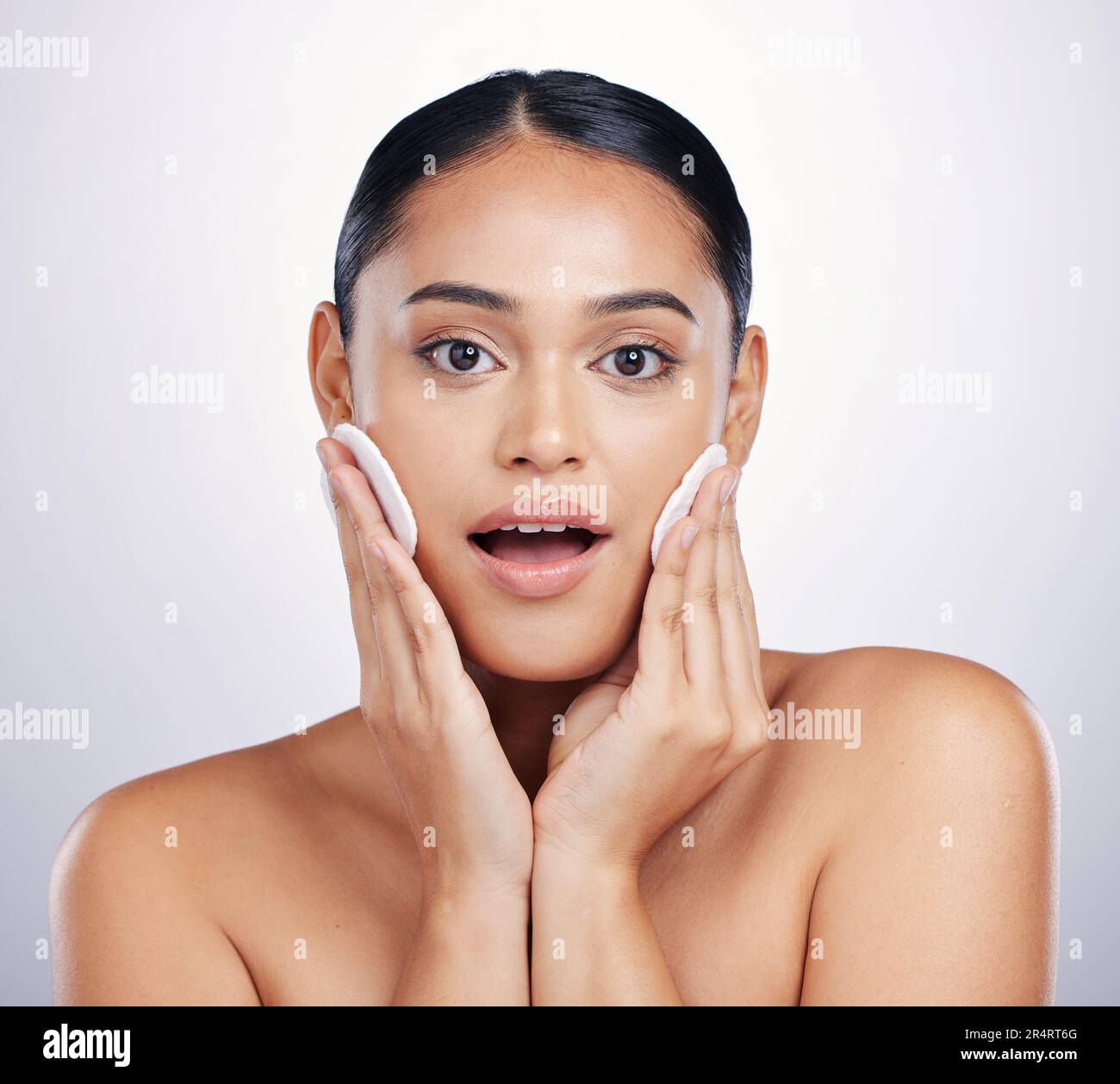 Beauty, face and clean cotton on skin of woman in studio for natural ...
