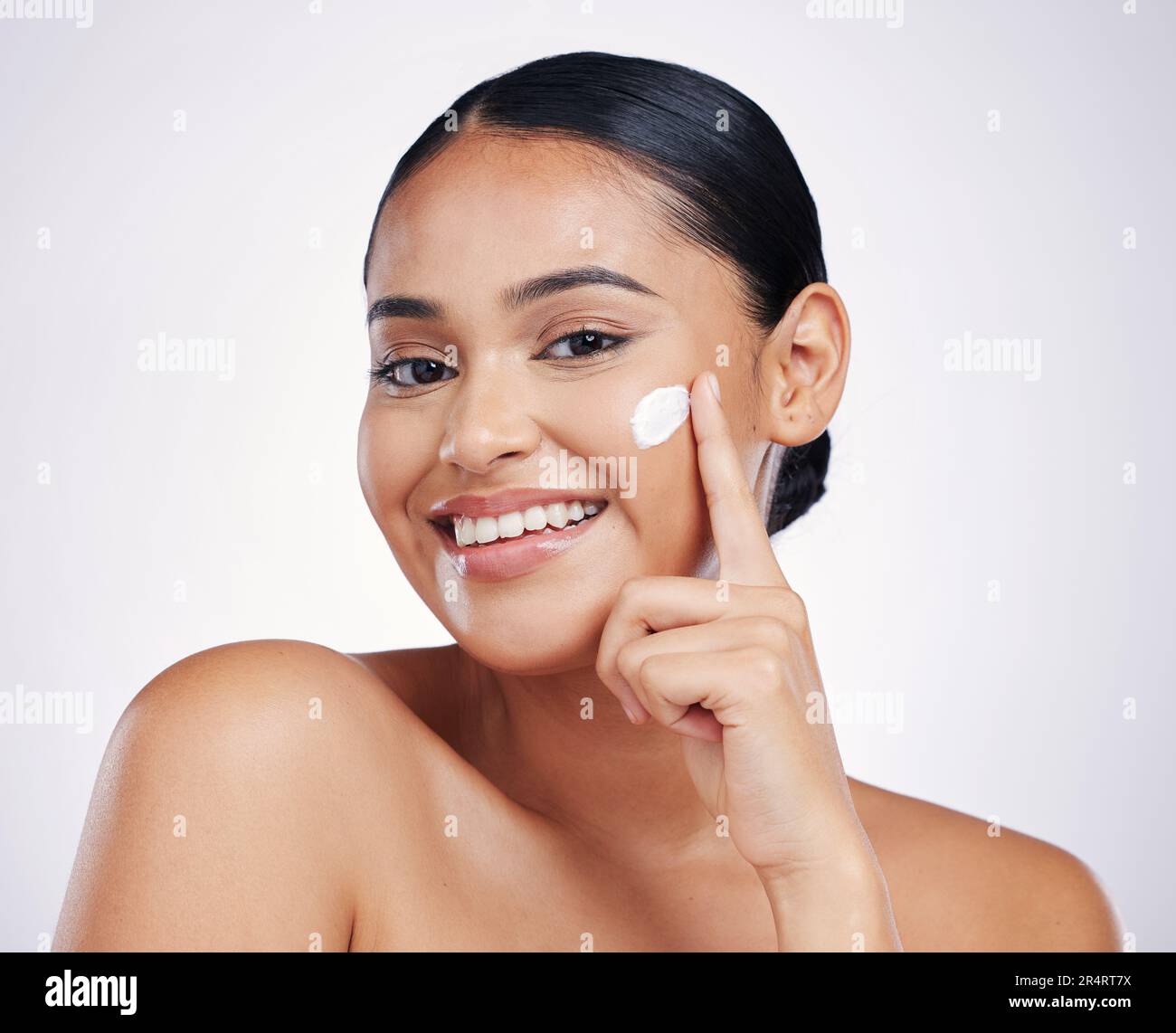 Woman in portrait, cream on face and beauty with skincare, smile and ...