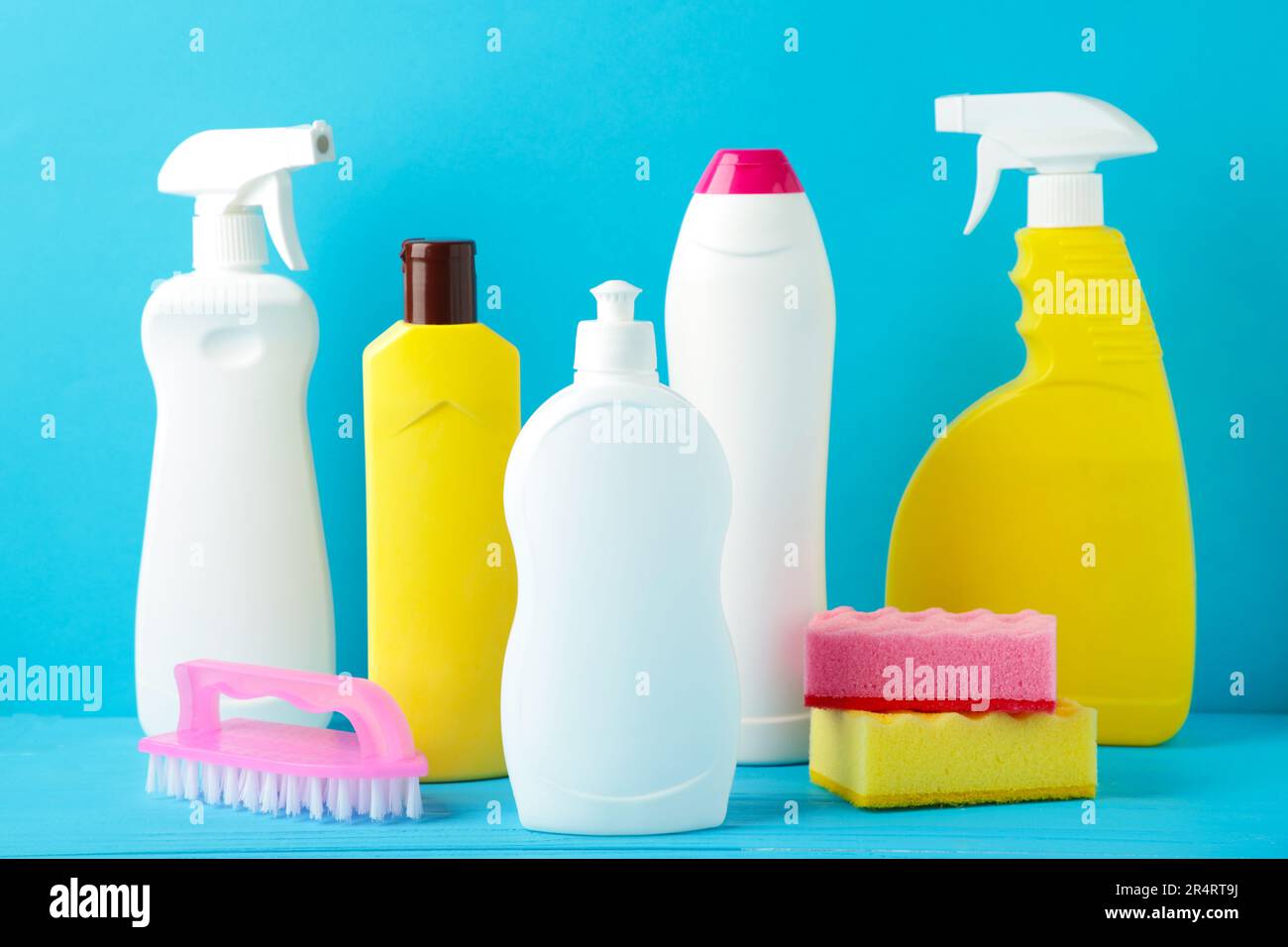 Set of cleaning tools on a blue background. Top view Stock Photo - Alamy