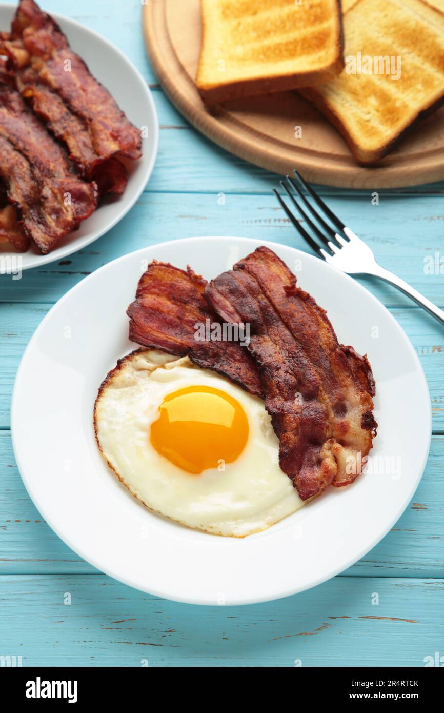 Eggs and bacon for breakfast on blue background. English breakfast. Top ...