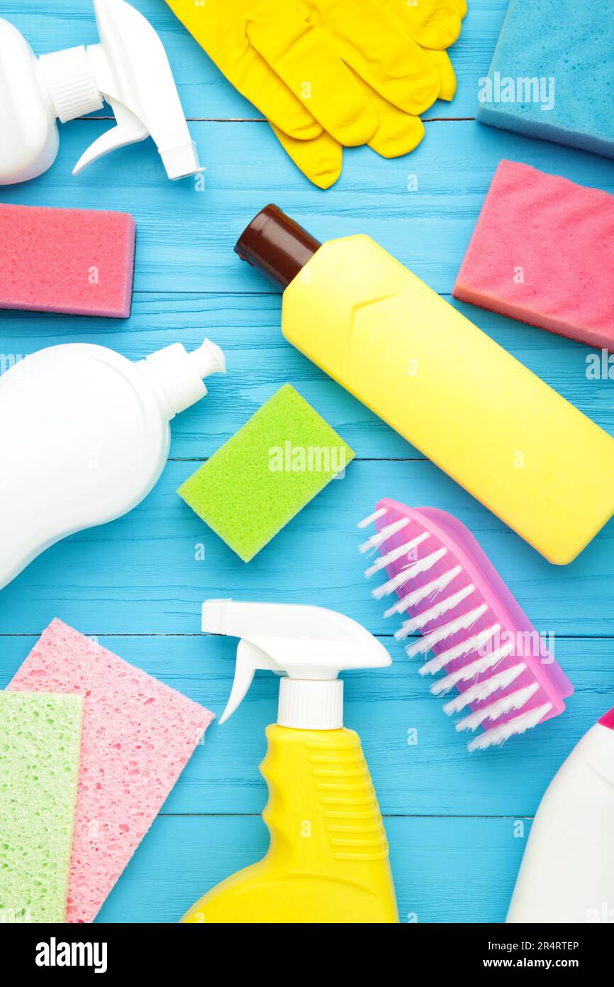 Set of cleaning tools on a blue background. Top view Stock Photo - Alamy