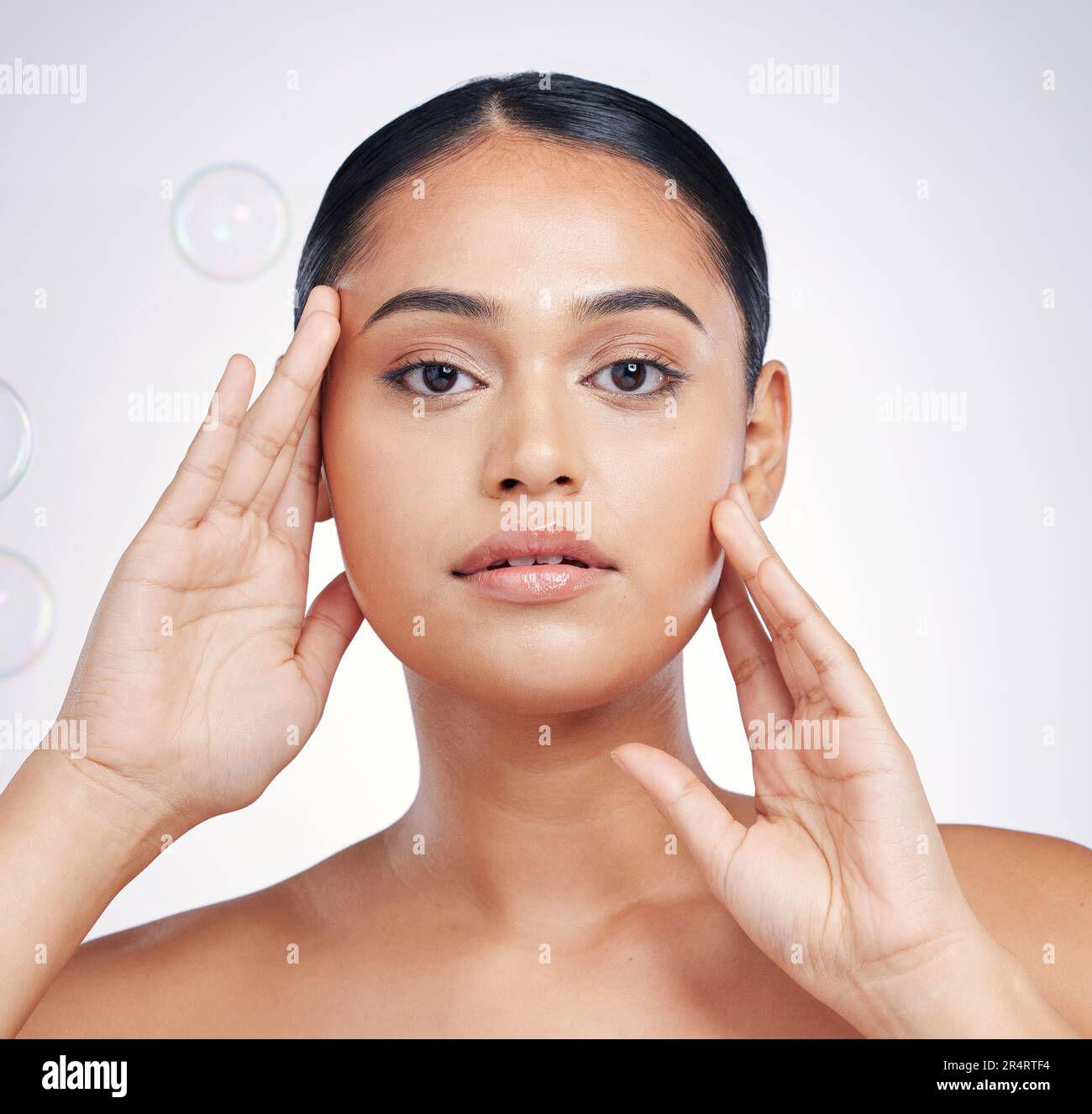 Beauty, natural and woman with hands on face in studio for glow, skin ...