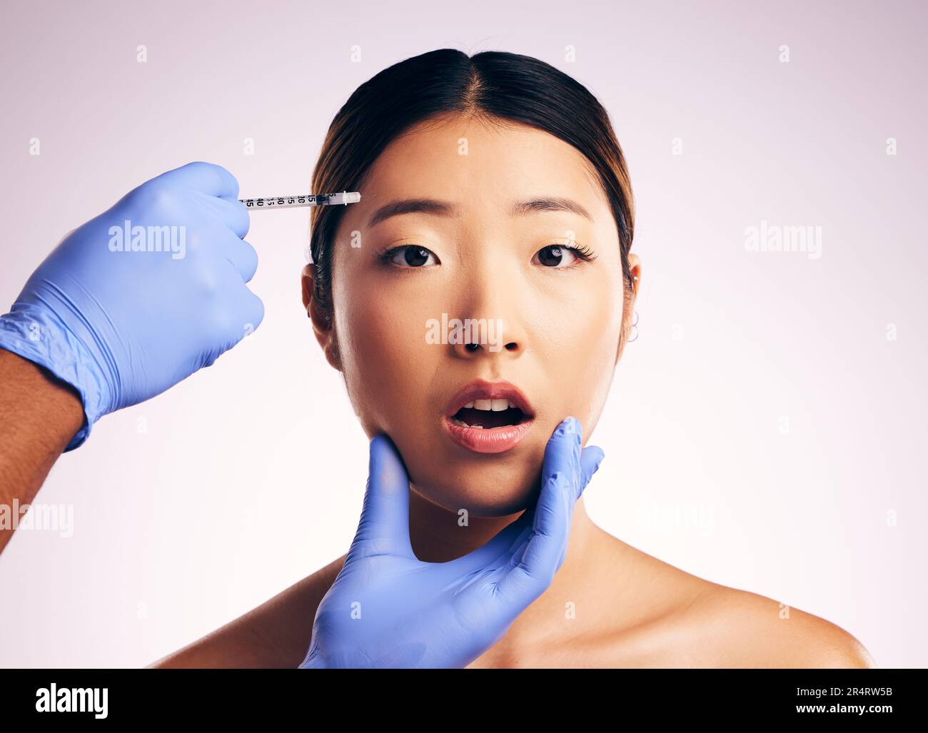 Face skincare, injection surprise and Asian woman in studio isolated on ...