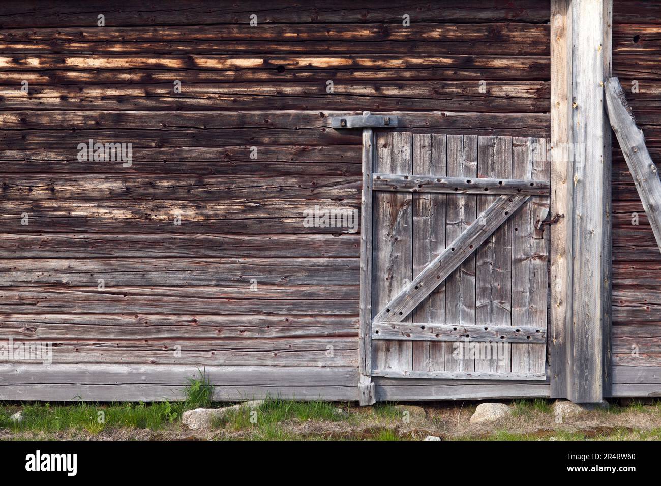 Close up on a timber wall of logs. The old windswept wooden building ...