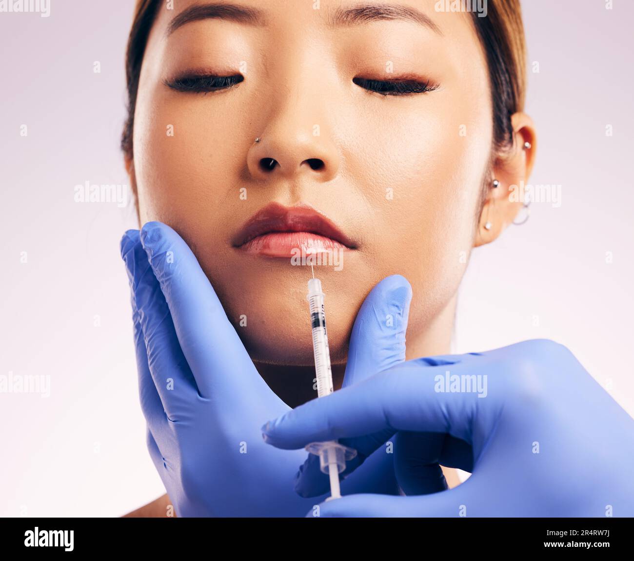 Lips injection, skincare and woman with plastic surgery in studio ...