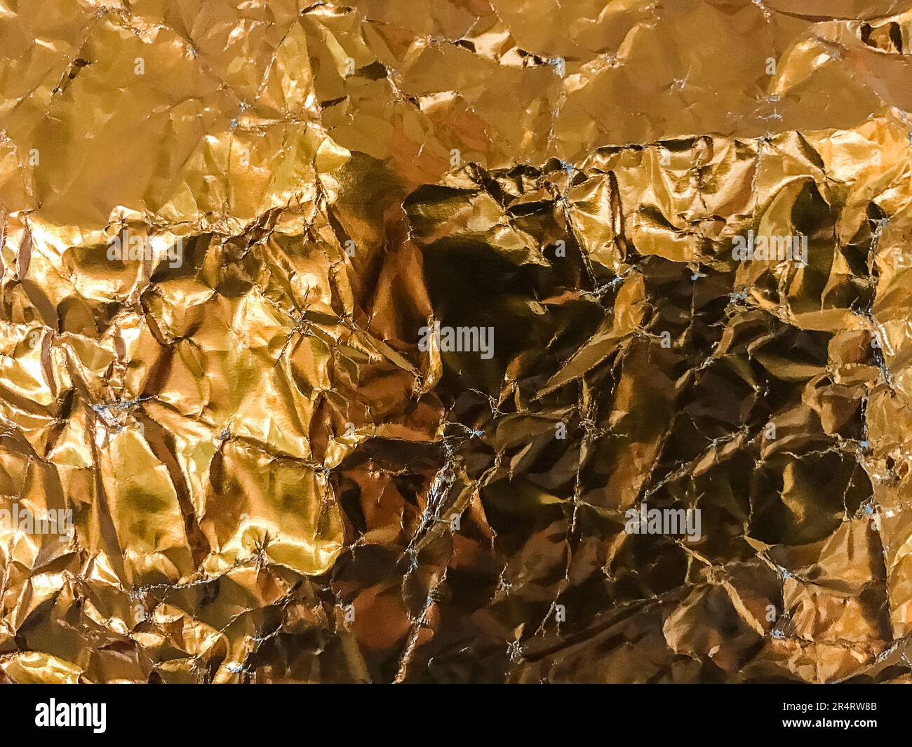 Golden paper wrinkled crumpled paper texture background Stock Photo - Alamy