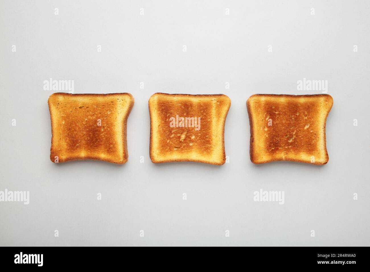 Toast bread on a grey background. Top view, flat lay Stock Photo - Alamy