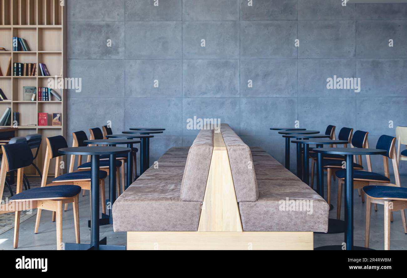 Interior of a modern cafe with sofas, chairs and tables Stock Photo - Alamy