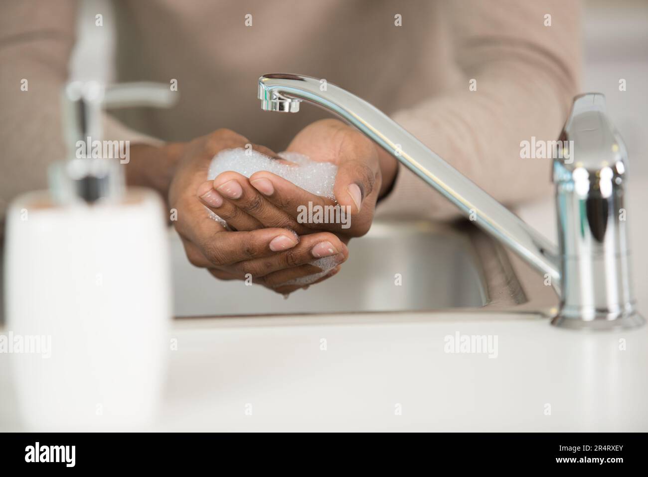 Soapy hands african hi-res stock photography and images - Alamy