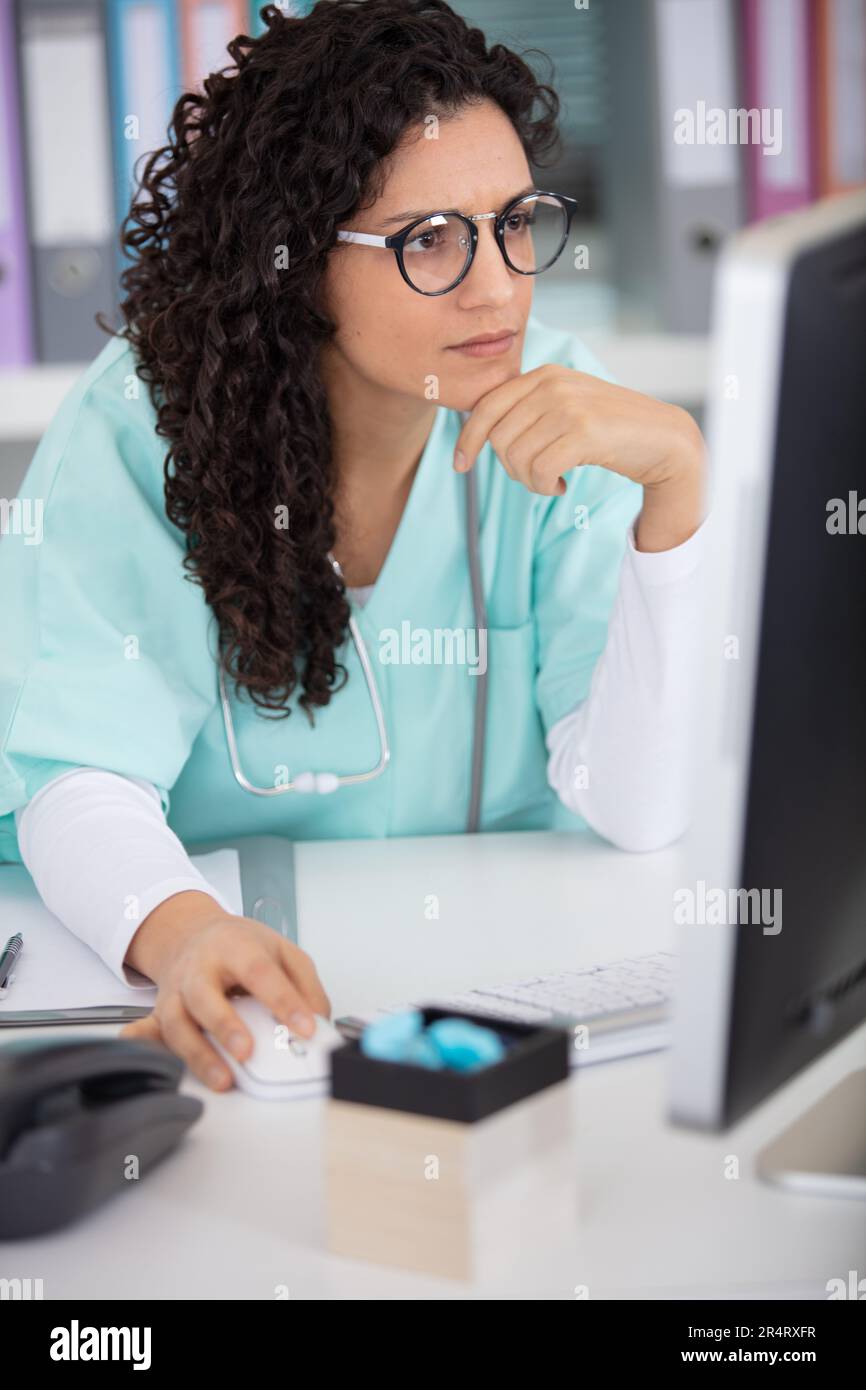 young female medic using a computer Stock Photo - Alamy