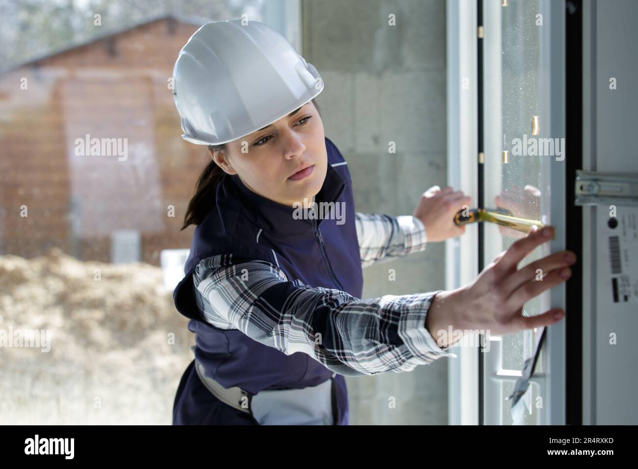 female worker measure the window Stock Photo - Alamy