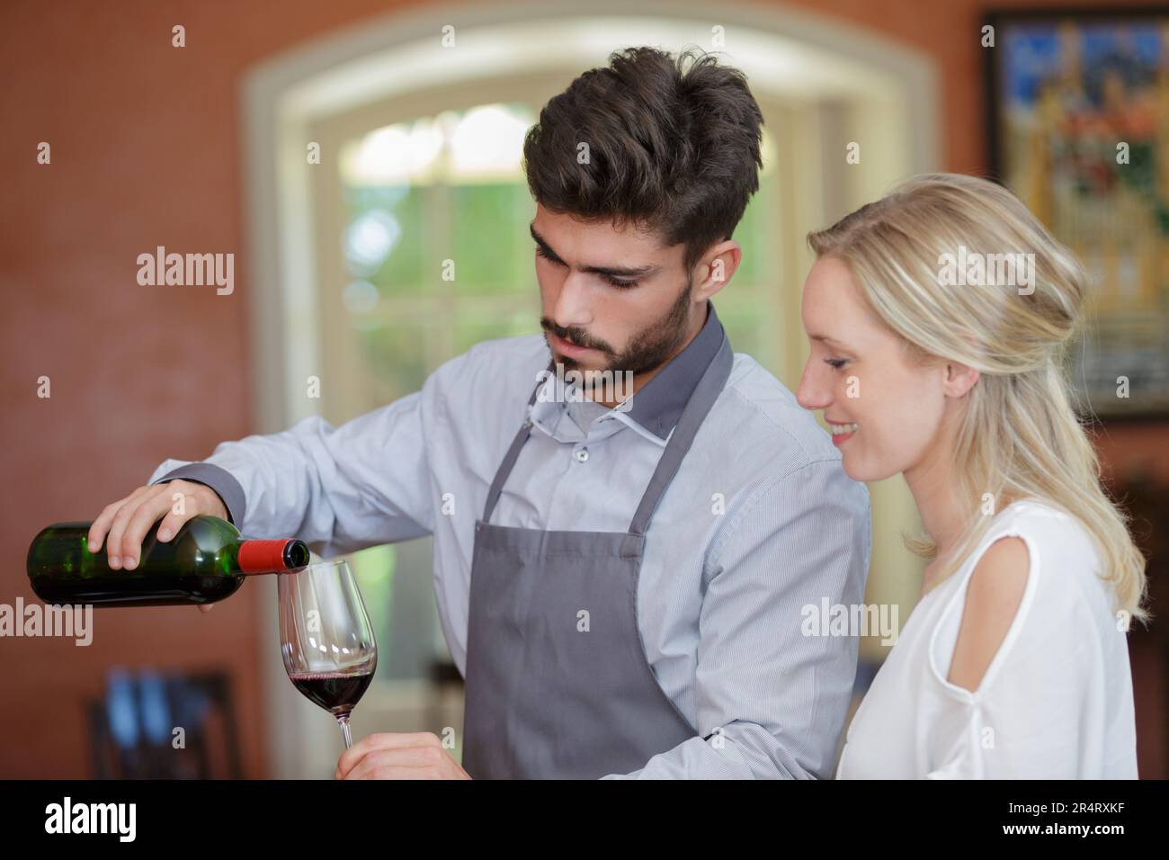 man sommelier tasting wine in the restaurant Stock Photo - Alamy