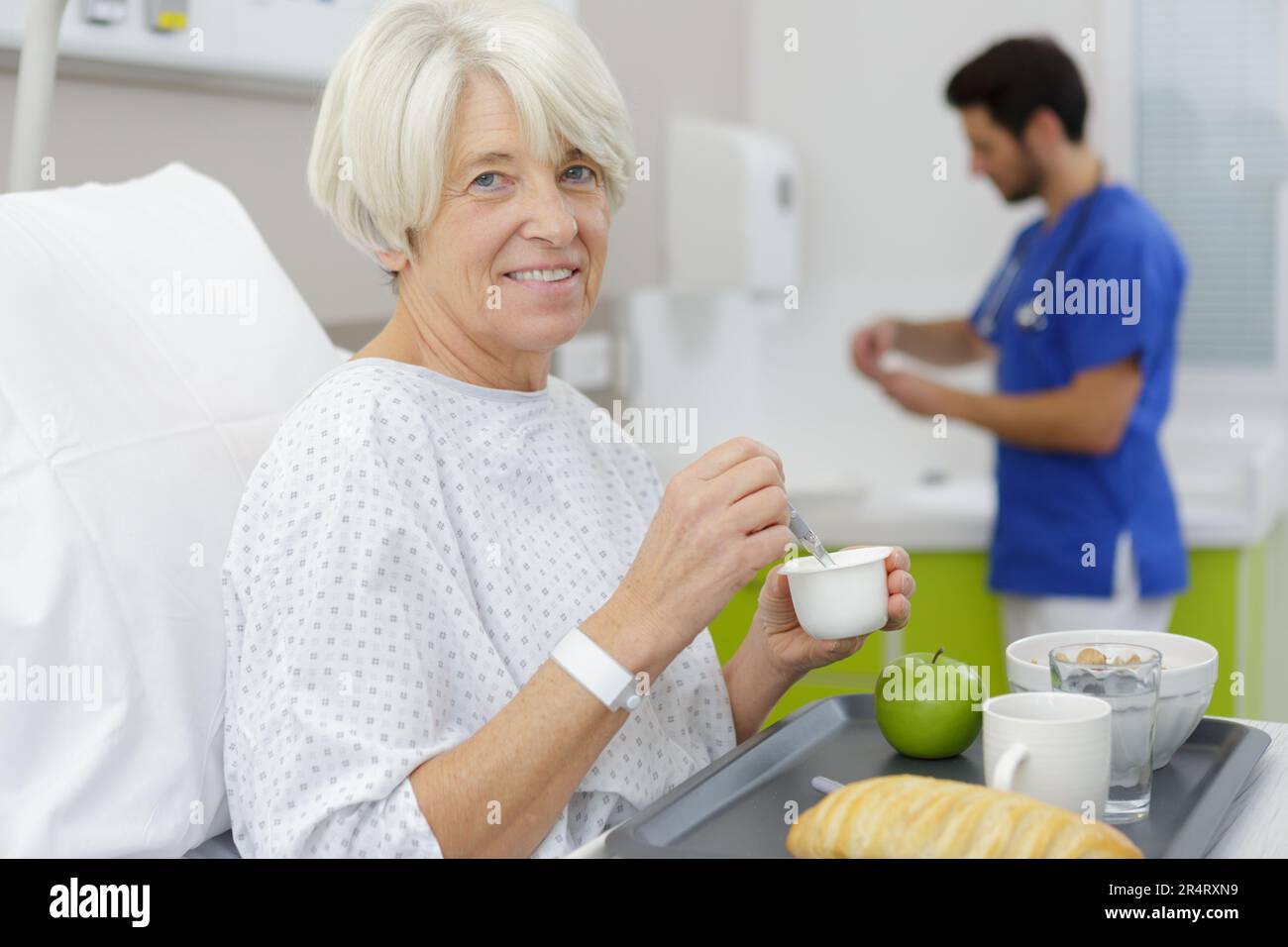older sick woman eating dinner at the hospital Stock Photo - Alamy