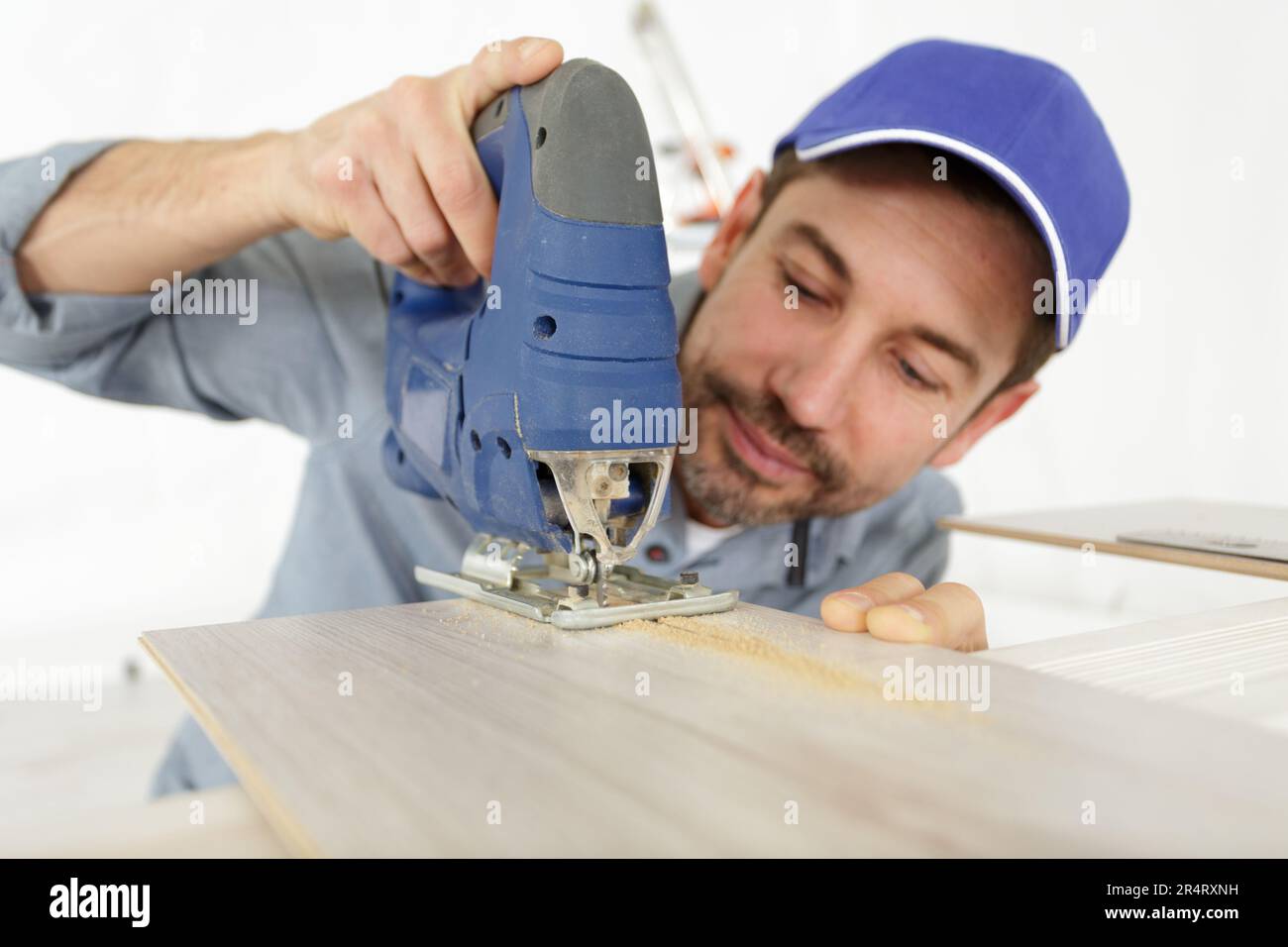 man cutting wood with a milling machine Stock Photo - Alamy