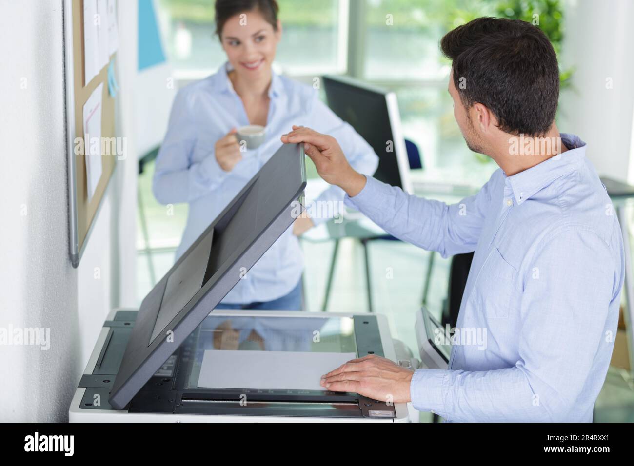 business people operating a copy machine Stock Photo - Alamy