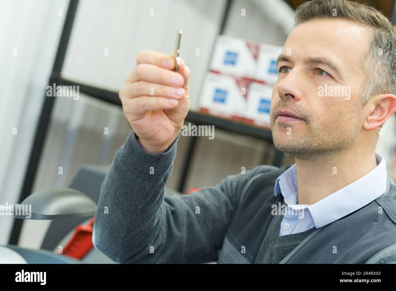 happy sales manager holding a key Stock Photo - Alamy