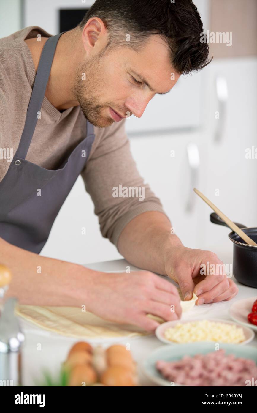 man making meal at home with pastry Stock Photo - Alamy