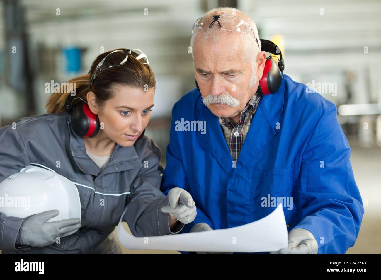 engineer and apprentice planning project Stock Photo - Alamy