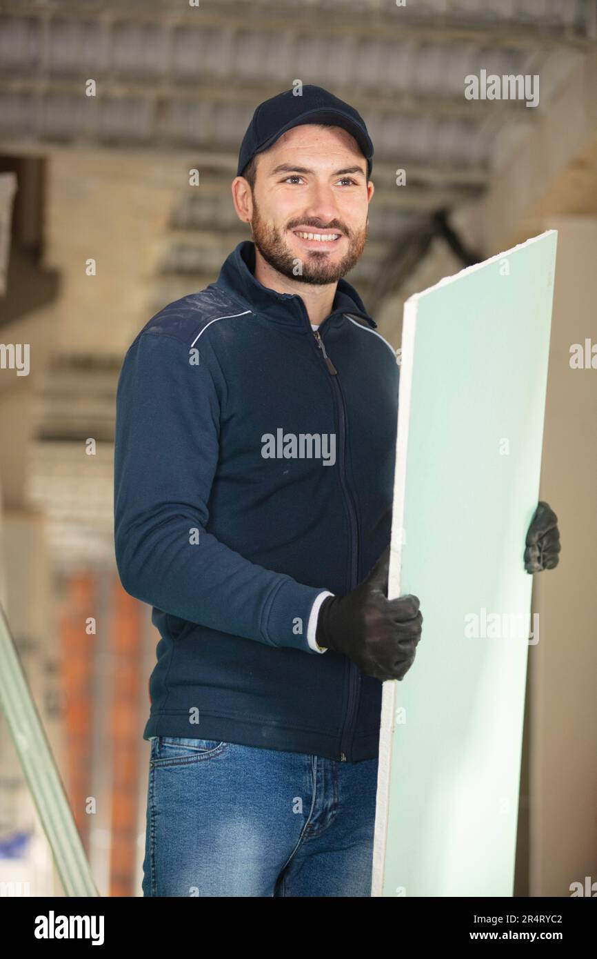 worker placing styrofoam polystyrene insulation to brick wall Stock ...