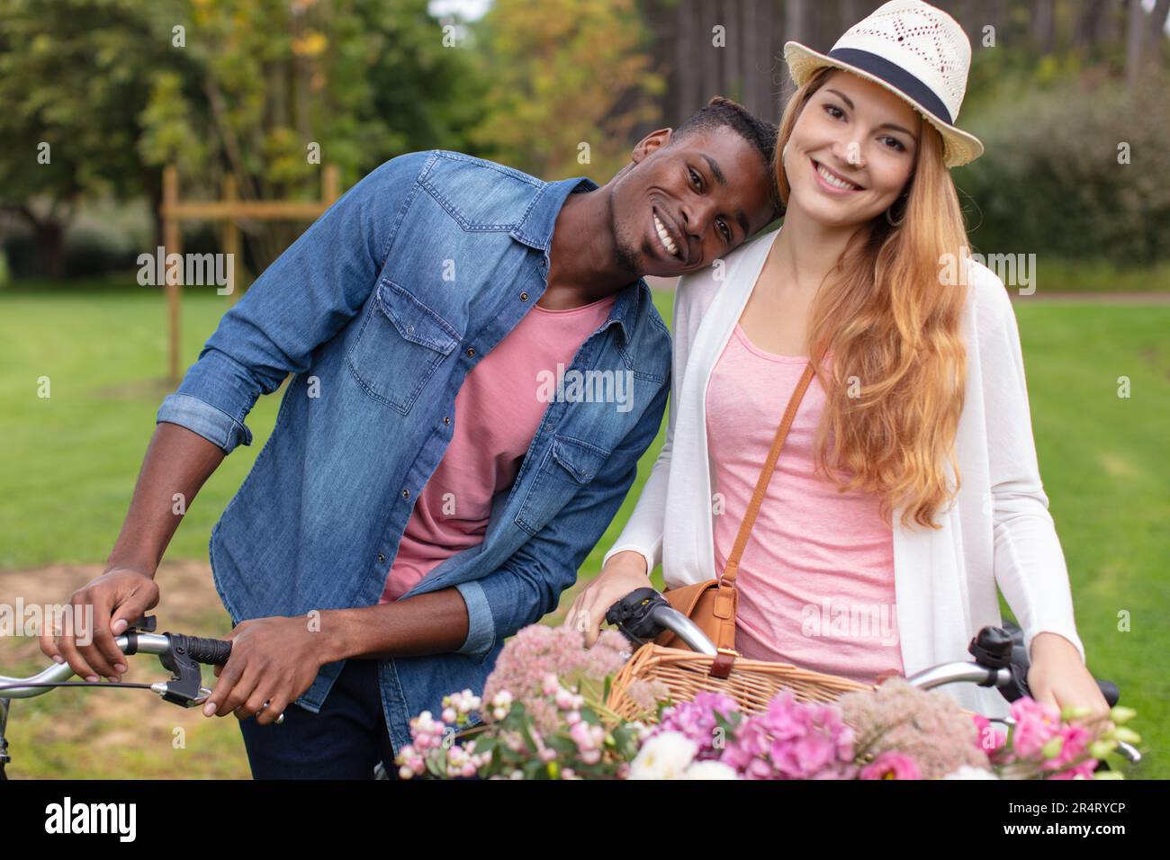 happy mixed couple going for a ride Stock Photo - Alamy