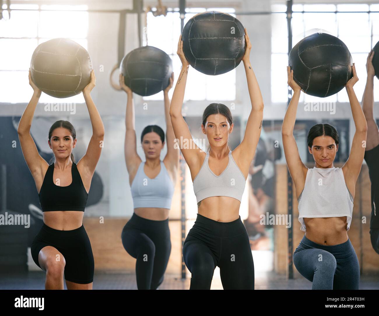 Fitness, portrait and women with medicine ball at a gym for sports ...